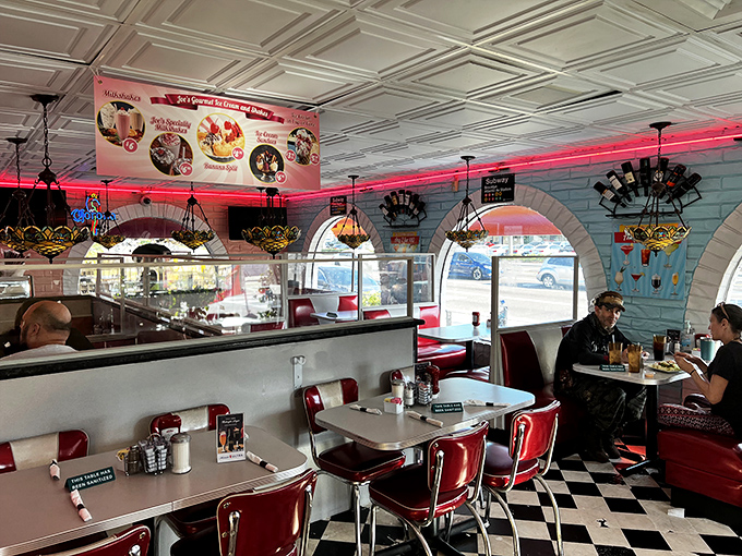 The interior glows with neon warmth as Tiffany-style lamps cast a gentle light over diners enjoying their meals&mdash;nostalgia you can eat in.
