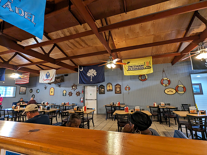The dining room wears its patriotism proudly, with South Carolina's palmetto flag and nautical accents creating the perfect backdrop for seafood feasting. 