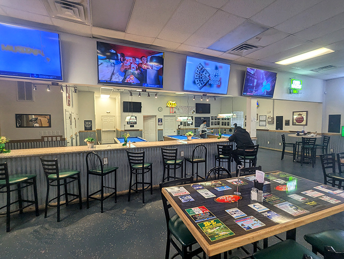 The bar area: where sports on TV meet cold beer and hot food. Those high-backed chairs aren't just seating&mdash;they're invitations to stay awhile.