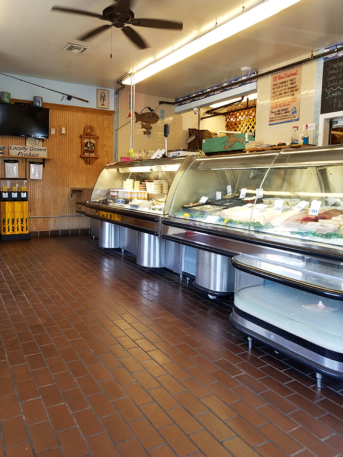 The seafood market display case showcases the day's freshest catches, letting quality speak for itself beautifully.