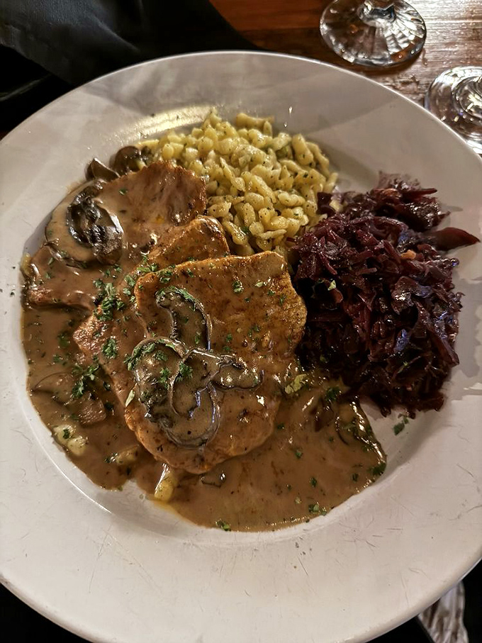 Jagerschnitzel swimming in mushroom sauce that you'll be tempted to drink with a straw. The red cabbage adds the perfect sweet-tart counterpoint.