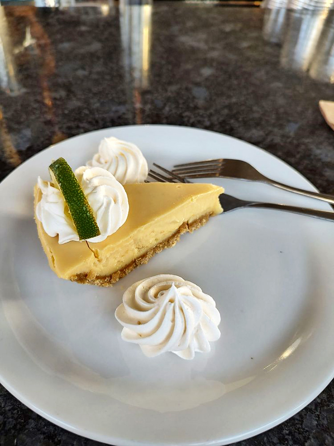 Key lime pie that strikes that perfect balance between sweet and tart&mdash;topped with whipped cream swirls and a lime slice for that Instagram-worthy finish.