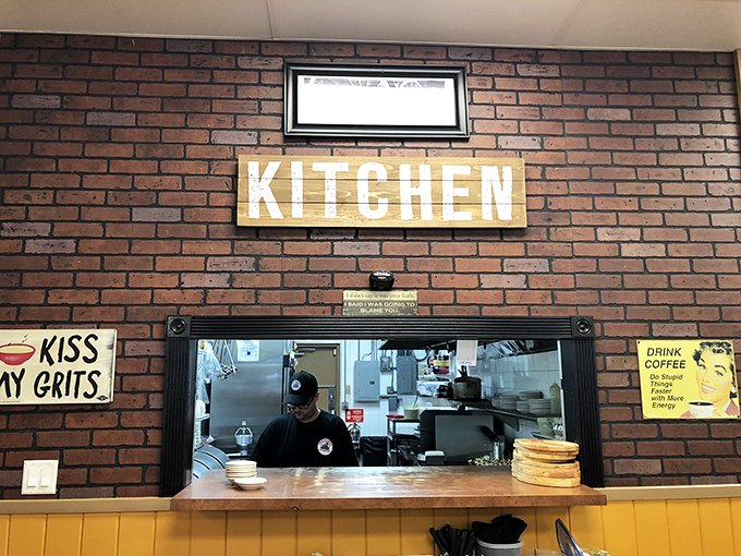 The kitchen pass&mdash;where "Kiss My Grits" isn't just a Flo reference but a genuine culinary philosophy worth embracing.