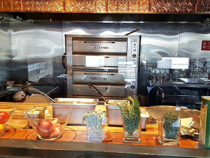 Fresh herbs standing at attention like tiny soldiers, ready to be deployed in the battle against boring pizza. The general? That impressive Blodgett oven.