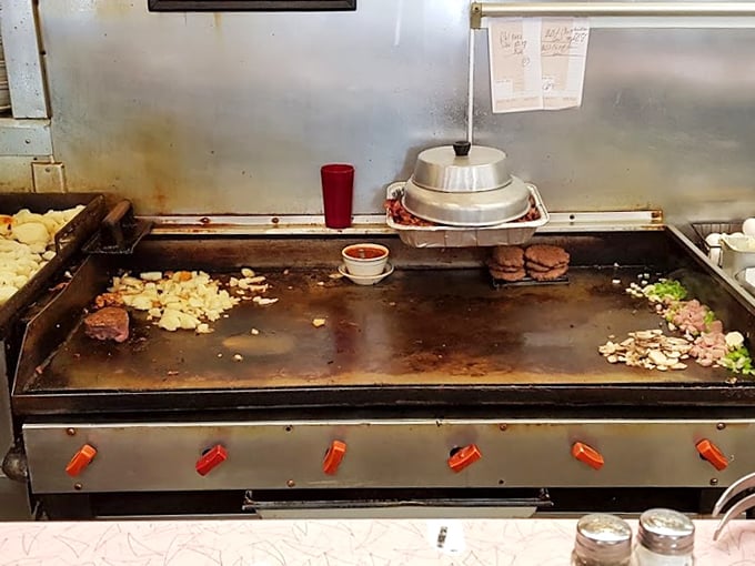 The flattop grill&mdash;hallowed ground where breakfast dreams materialize from sizzling choreography and decades of short-order wisdom.