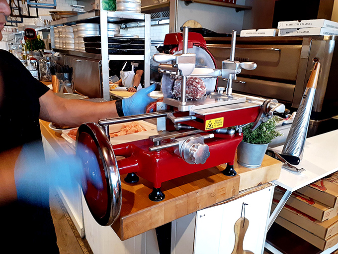 Behind every perfect plate is this scene: practiced hands, professional equipment, and the kind of attention to detail that separates good from unforgettable.