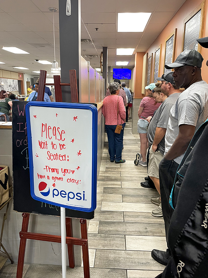 The "Please Wait to be Seated" sign might as well say "Good Things Come to Those Who Wait." And these patient folks know it.