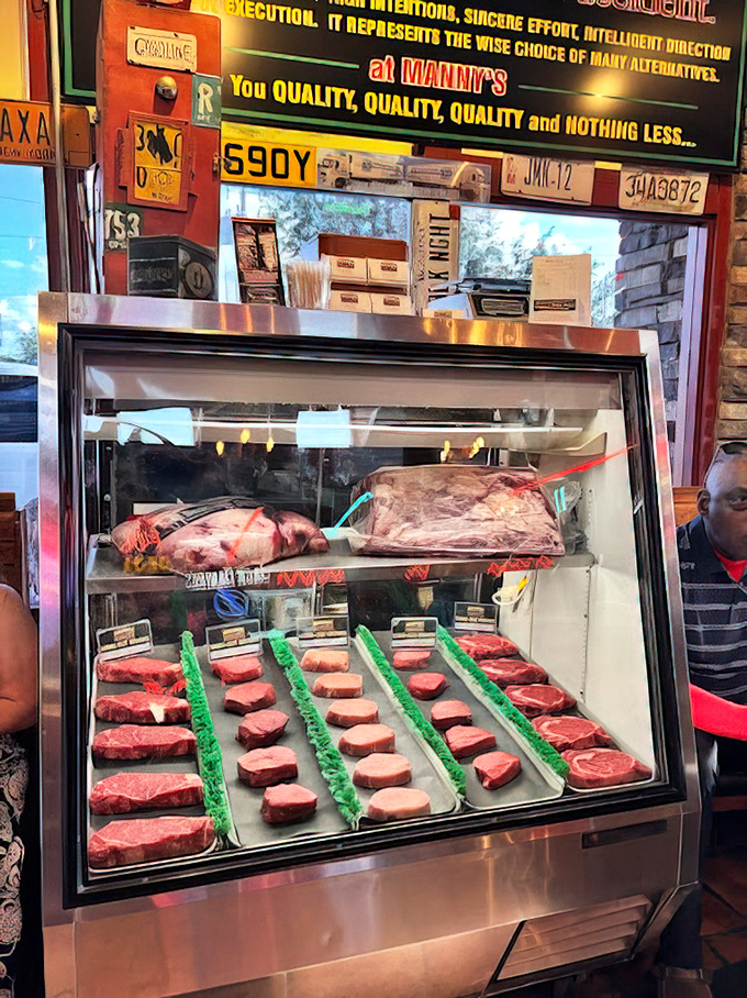 Raw steaks await their transformation in this temperature-controlled showcase of beef excellence.