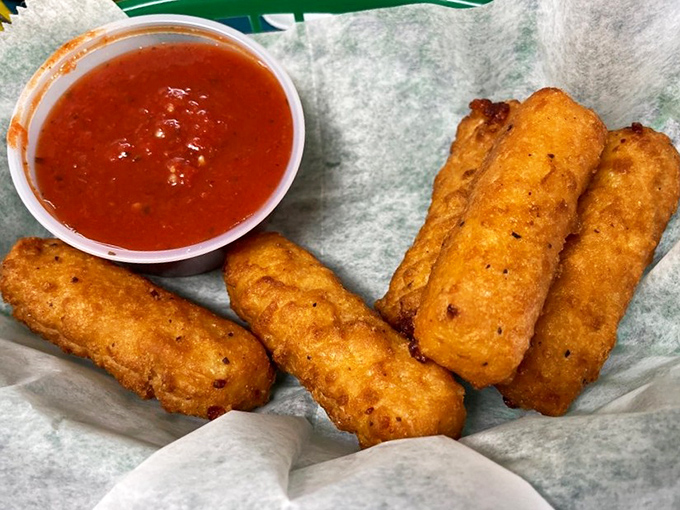 Golden-fried mozzarella sticks that stretch dramatically when pulled apart, creating that Instagram-worthy cheese pull your followers secretly envy.