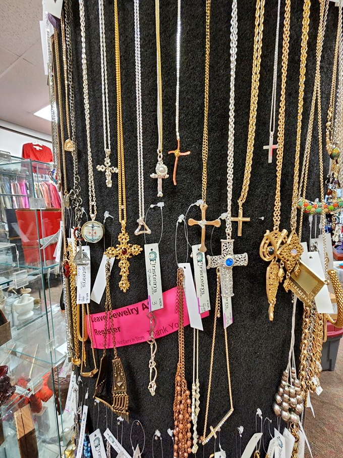 A spiritual jewelry counter where crosses and chains hang like metallic prayers, waiting to adorn necks and express faith.
