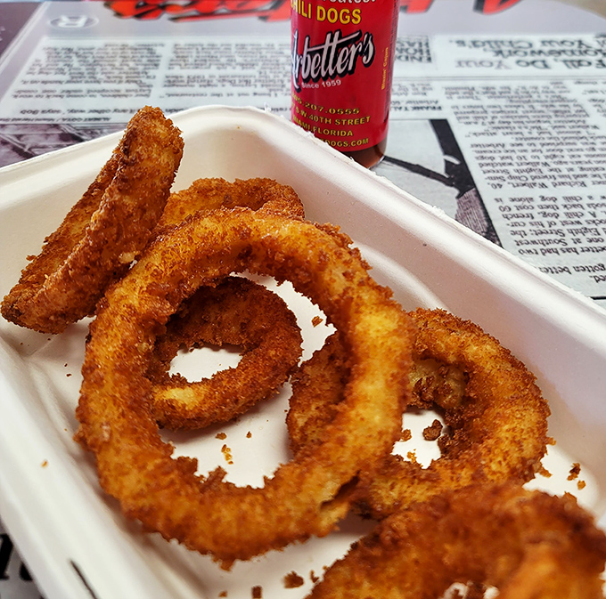 These onion rings aren't just side dishes &ndash; they're golden halos of crispy perfection that deserve their own moment of silence.