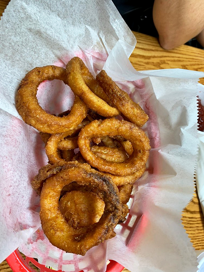 Onion rings wearing their golden jackets proudly&mdash;crispy, light, and ready to complement that barbecue.