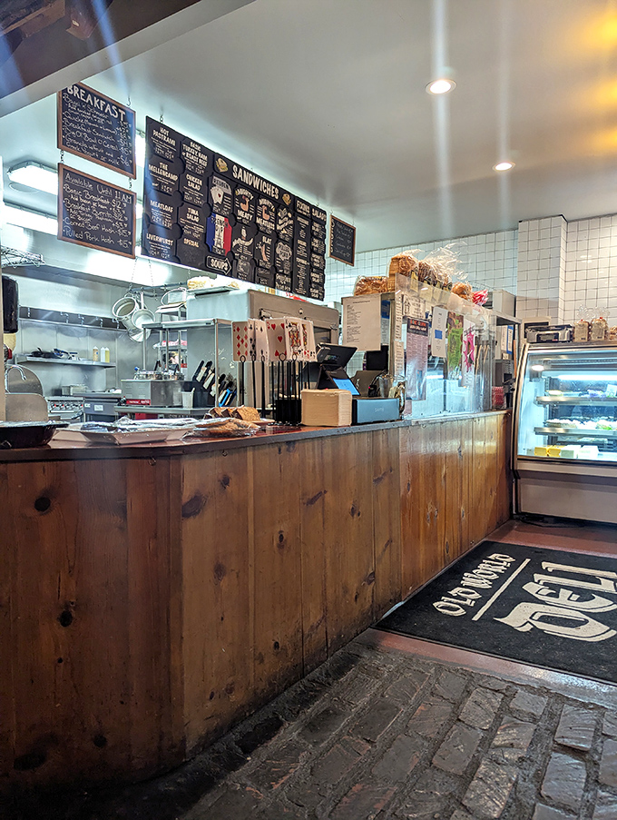 Where sandwich dreams begin. The order counter's menu board tempts with possibilities while the display case flaunts what could soon be yours.