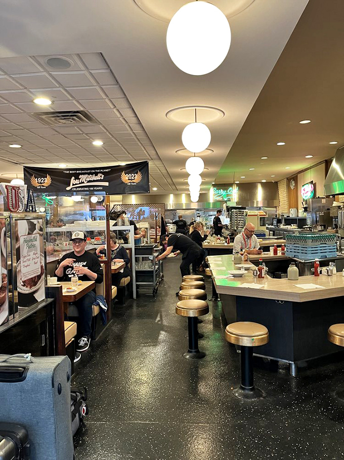 The diner's heartbeat&mdash;a counter where regulars have claimed their spots for decades. Those globe lights have illuminated countless "I needed this" first sips of coffee.
