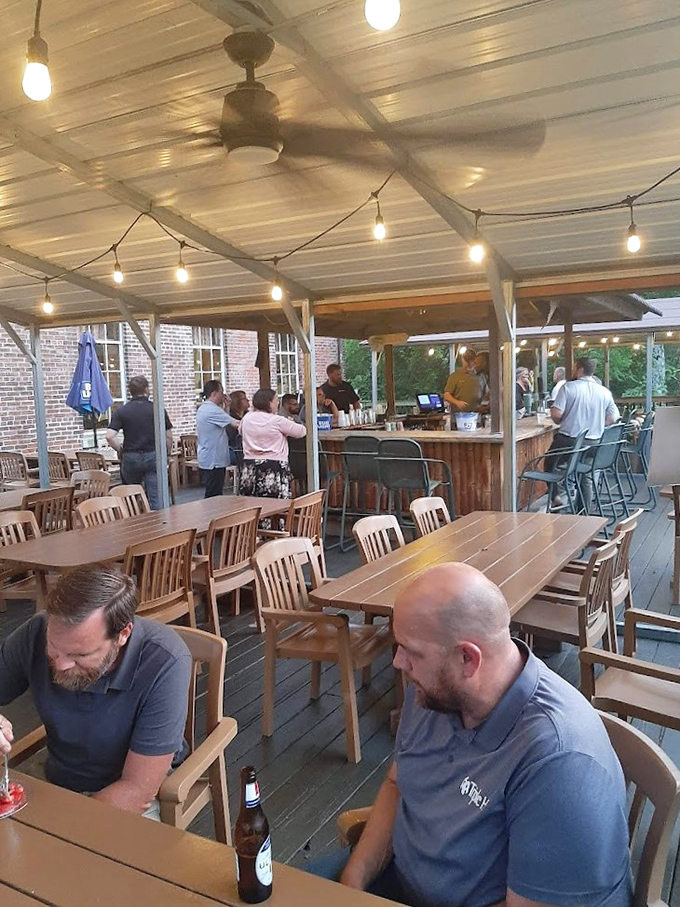 The patio fills up quickly on pleasant evenings, where conversations flow as freely as the drinks from the outdoor bar.