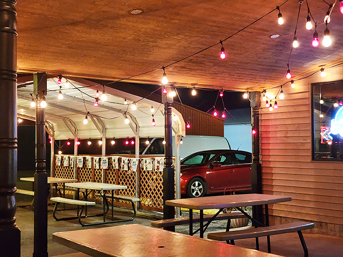 The outdoor seating area, where string lights create the perfect ambiance for contemplating the meaning of life and ribs.