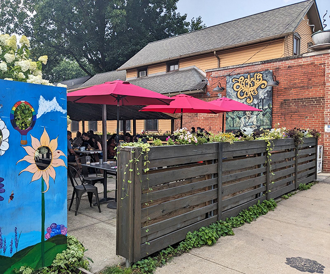 The outdoor patio, framed by wooden fencing and bright umbrellas, offers a garden oasis perfect for savoring those biscuits in Cleveland's fleeting summer months.