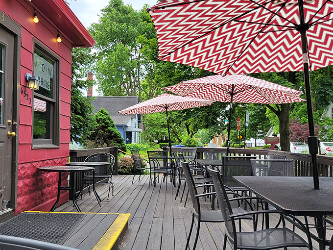 The patio where summer memories are made. Red and white umbrellas create the perfect setting for al fresco dining along the Monon Trail.