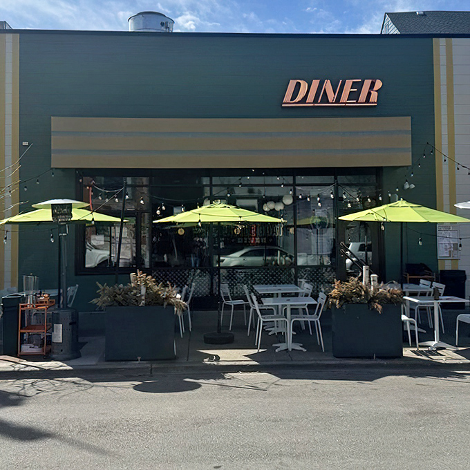 The outdoor seating area, complete with cheerful yellow umbrellas, offers a perfect stage for your own personal breakfast theater.