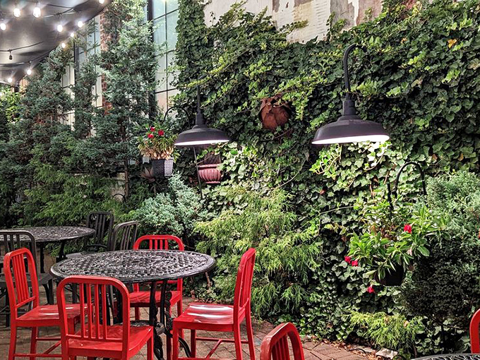 The outdoor seating area, with ivy-covered walls and string lights, feels like the secret garden party you've always wanted an invitation to.