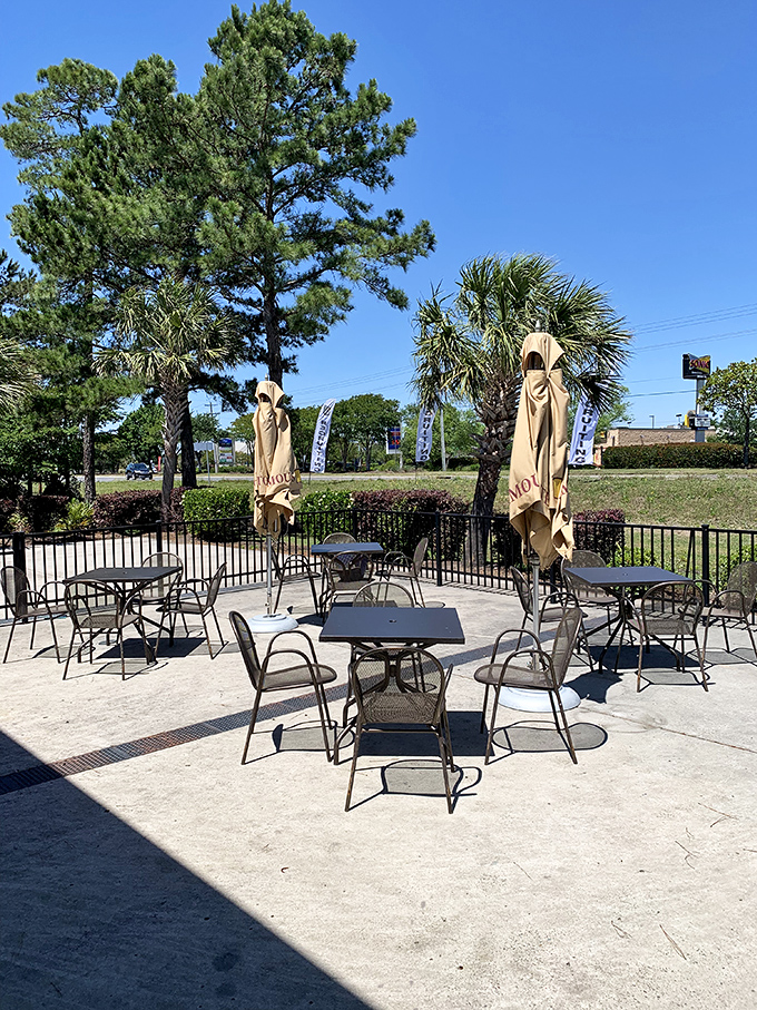 Outdoor seating for those "too gorgeous to be inside" South Carolina mornings, complete with umbrellas to shield your eggs from sunshine overexposure.