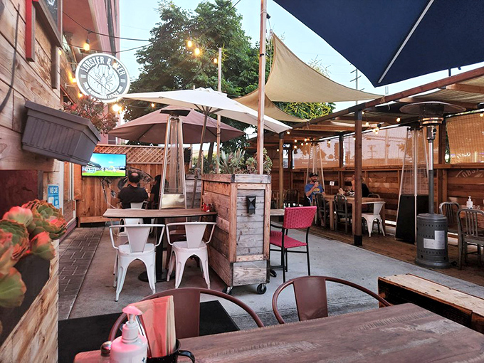 The outdoor patio&mdash;where California sunshine meets seafood indulgence under canvas sails and market lights.