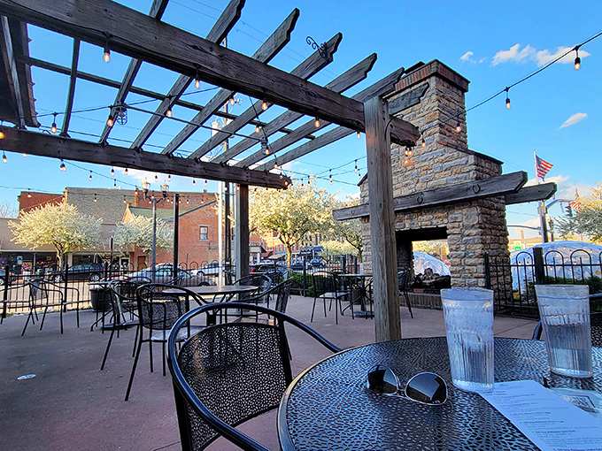 The outdoor patio offers string lights, pergola shade, and a stone fireplace&mdash;a trifecta of al fresco dining perfection. You'll forget you're in Ohio, not Tuscany.