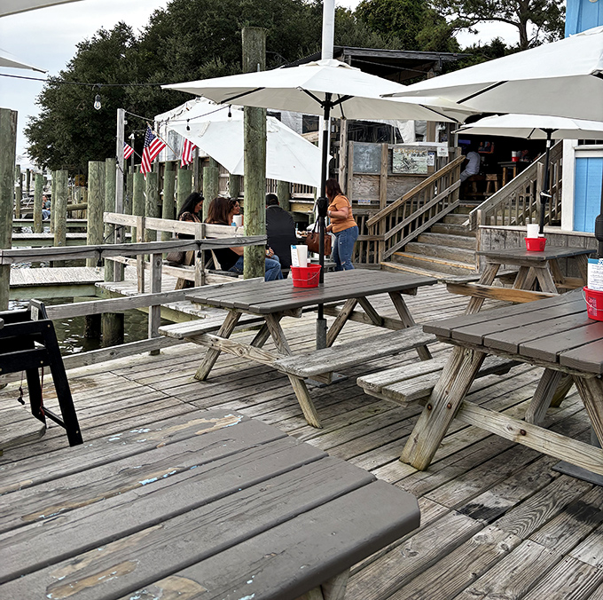 Outdoor dining that makes you wonder why you ever eat indoors. Wooden picnic tables, water views, and the promise of seafood bliss.