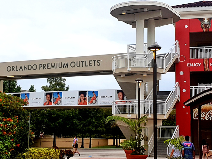 The Orlando Premium Outlets overpass stands like a retail rainbow, with Coach as the pot of gold waiting on the other side.