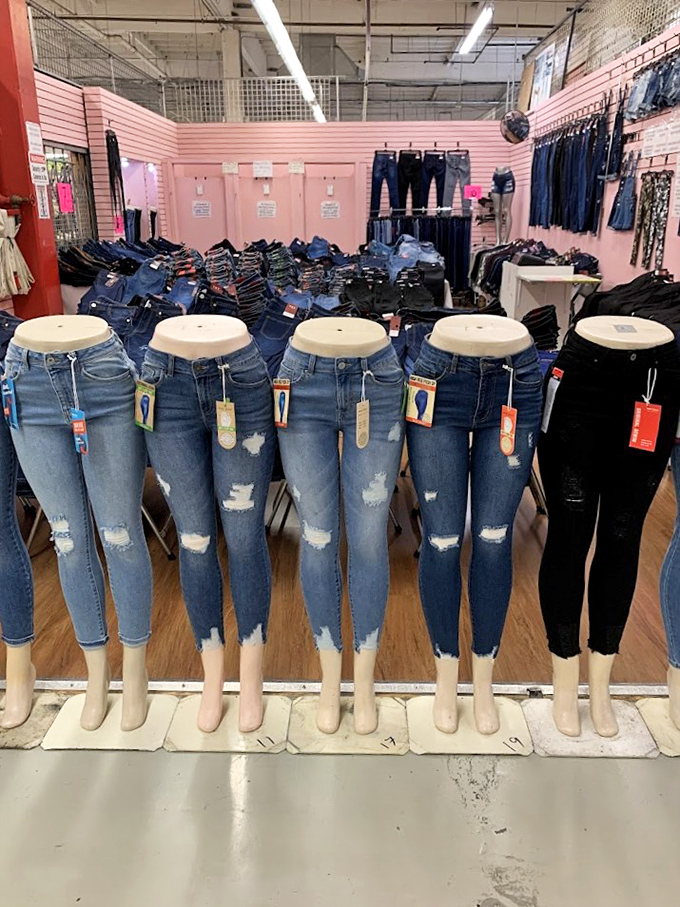 Denim democracy: five mannequin legs modeling the universal language of fashion. The distressed look has never been so deliberately perfect.