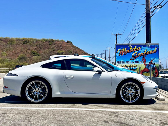 Even luxury cars make pit stops for great seafood. When Porsches park outside a casual fish shack, you know something special's happening inside.
