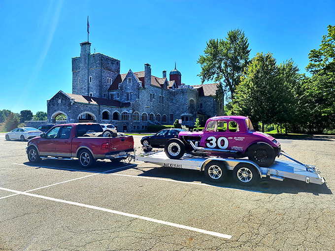 Even the parking lot offers a perfect castle backdrop for classic cars, proving that American ingenuity and European grandeur make excellent neighbors.