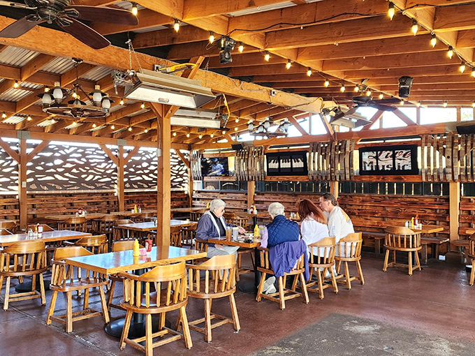 Outdoor seating that captures California's perfect weather. String lights overhead create the ambiance of a countryside dinner party.