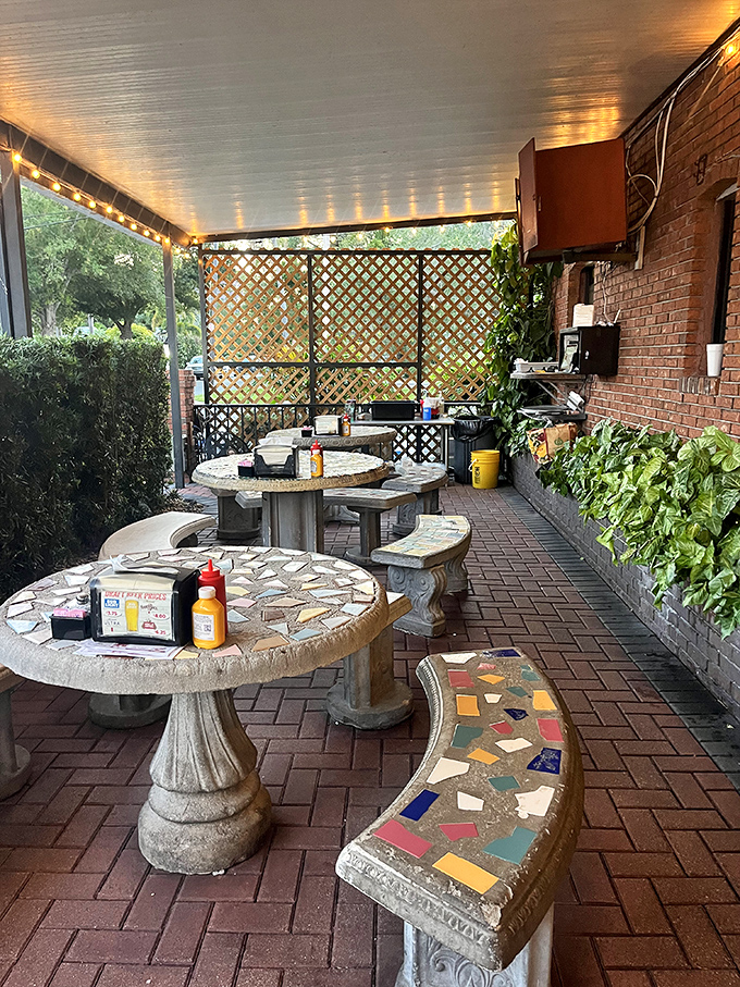 The patio offers Florida dining at its most authentic: brick pavers, mosaic tables, and the kind of casual charm you can't manufacture.