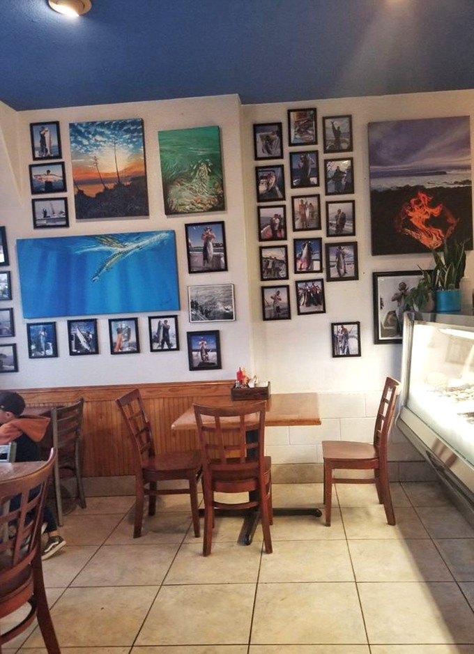 A gallery of fishing triumphs covers the walls like a maritime museum. Each photo frame holds a story of the one that didn't get away.