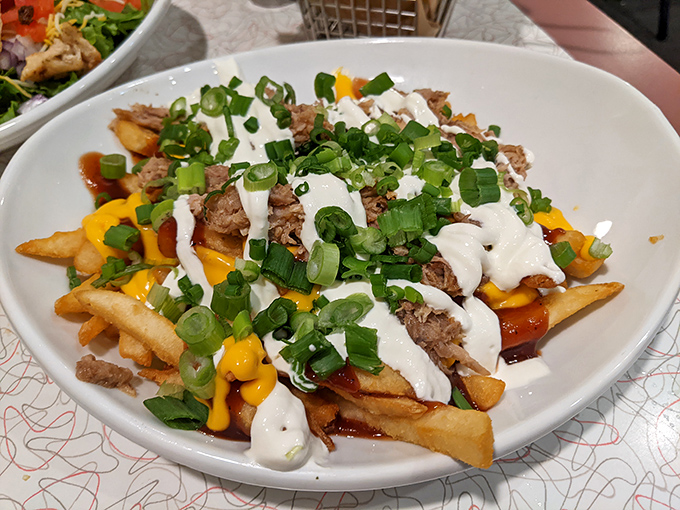 Creative presentations like this loaded fries dish demonstrate the kitchen's playful approach to comfort food.