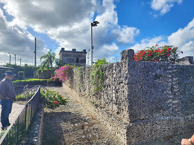 The massive coral walls surrounding the property have withstood hurricanes that flattened modern buildings, suggesting Ed knew structural secrets worth studying.