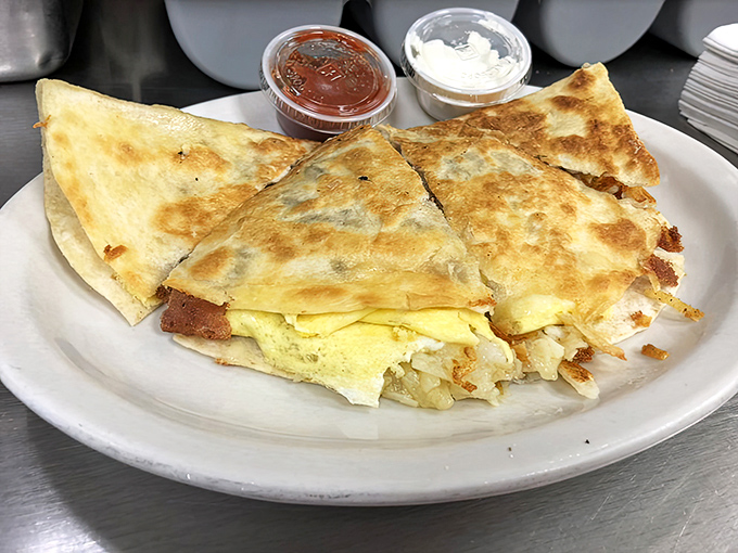 Breakfast quesadilla with perfectly melted cheese peeking out from its golden-brown tortilla &ndash; Mexican inspiration meets Ohio morning hunger.