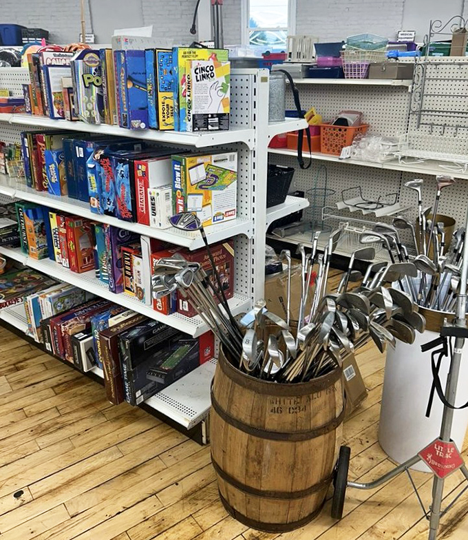 Golf clubs huddle in a rustic barrel while board games stand ready. Weekend entertainment options that don't require charging or software updates.