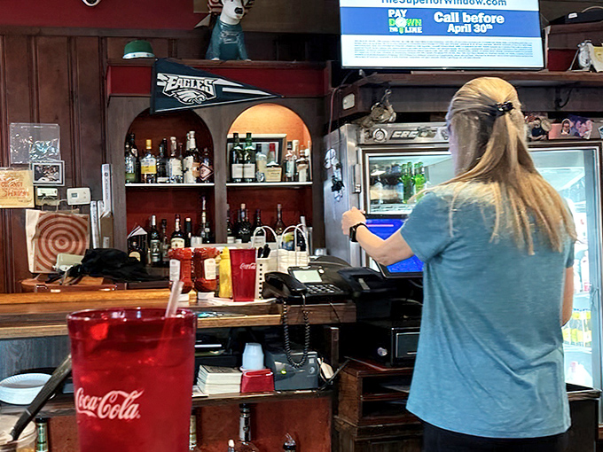 An Eagles pennant watches over the register—this is Philadelphia territory, where sports loyalty and food loyalty go hand in hand.