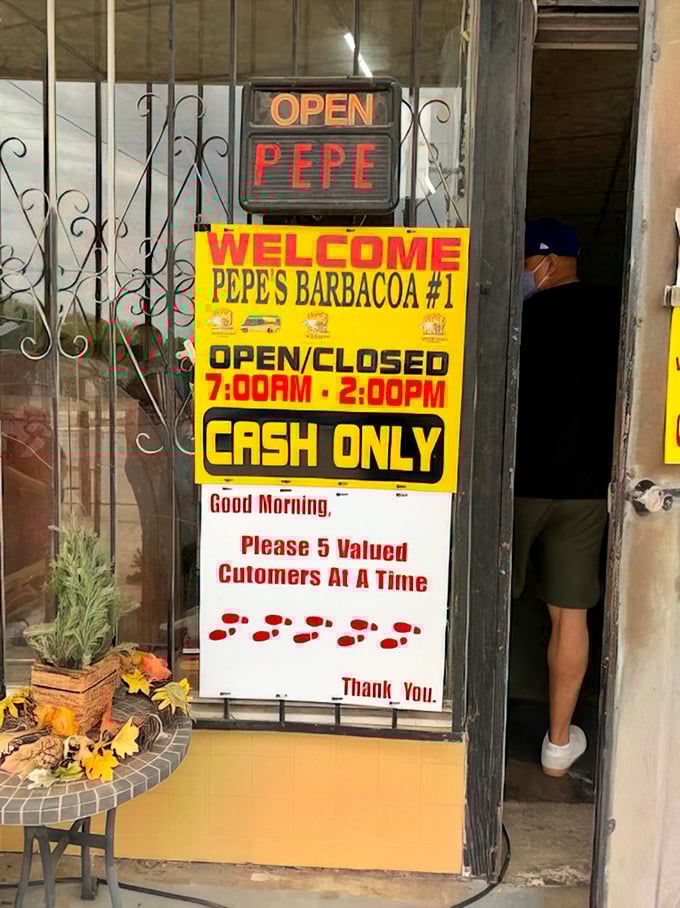 Clear signage reminds customers of the cash-only policy and limited capacity that adds to the authentic charm.