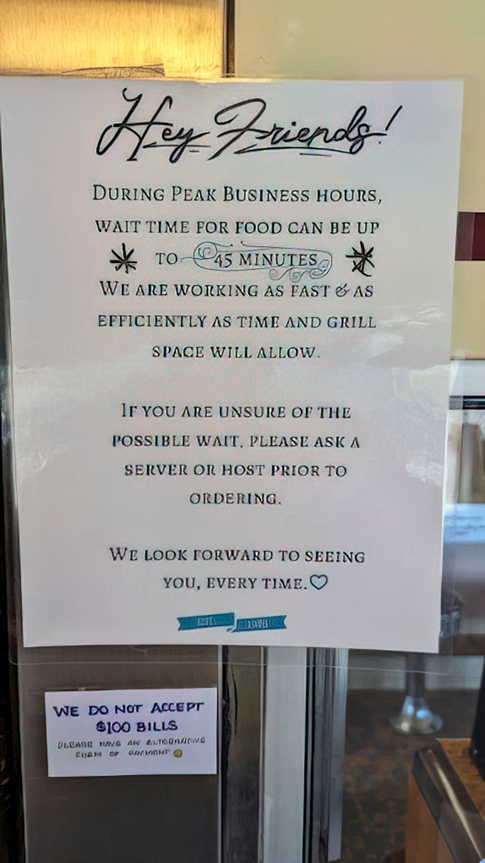 A friendly reminder that good things take time&mdash;a sign that speaks volumes about the care behind every plate that emerges from the kitchen.