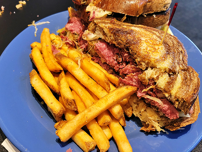 The Reuben: where corned beef, sauerkraut, and grilled bread come together in a sandwich that's worth every napkin you'll need.