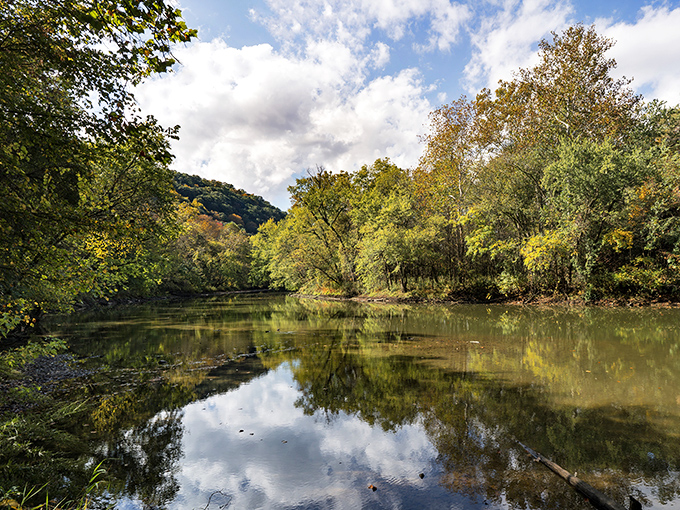 The gentle waters below carry more than just current &ndash; they carry the whispers of countless stories.