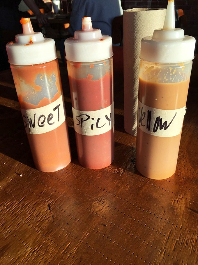 Three squeeze bottles of barbecue salvation &ndash; sweet, spicy, and yellow. Choose your adventure or try all three.