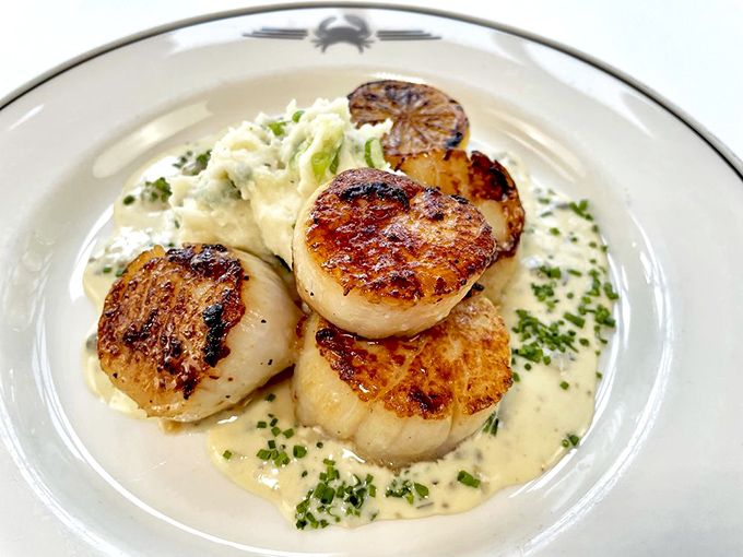 These scallops aren't just seared&mdash;they're caramelized to the edge of divinity, swimming in a sauce that should be bottled and sold as liquid happiness.
