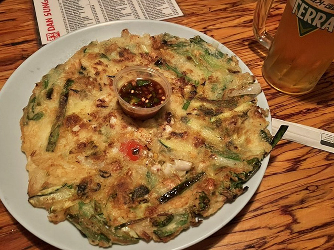 The seafood pancake arrives like an edible stained-glass window. Crispy edges give way to tender interiors studded with treasures from the sea.