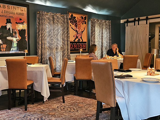 Dining room walls adorned with vintage posters that tell stories. The kind of atmosphere that makes you linger over that last bite.