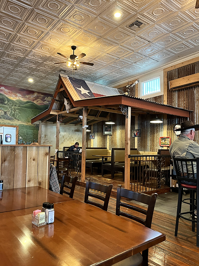 Rustic charm meets Texas hospitality under ornate tin ceilings. That little house-within-a-restaurant setup? Pure genius for intimate dining.