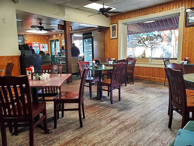 Wooden chairs, warm lighting, and the promise of comfort food—this dining room isn't just a space, it's a Southern breakfast sanctuary.